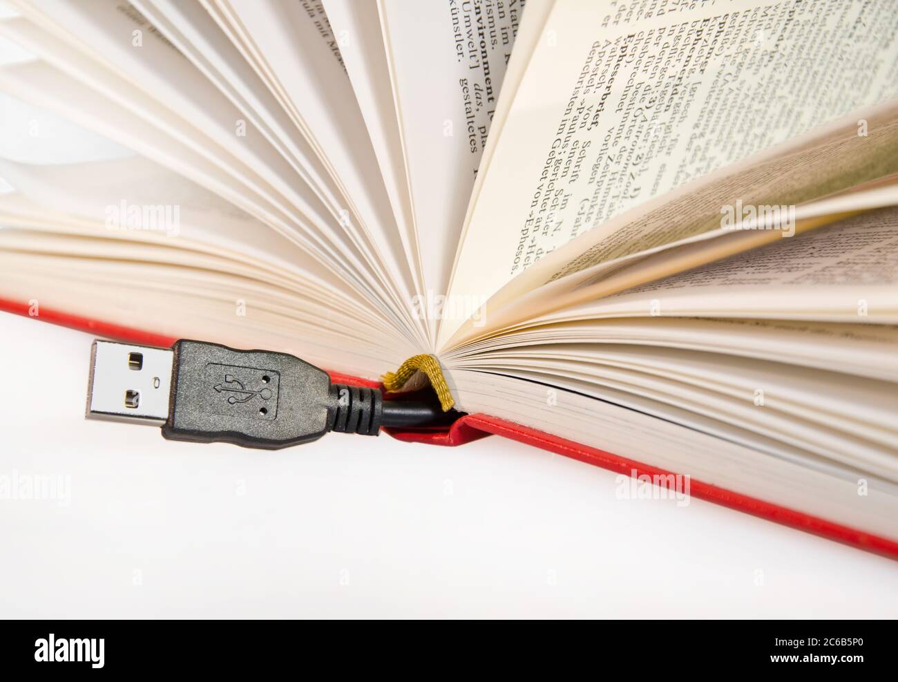 Book with USB cable sticking out Stock Photo - Alamy