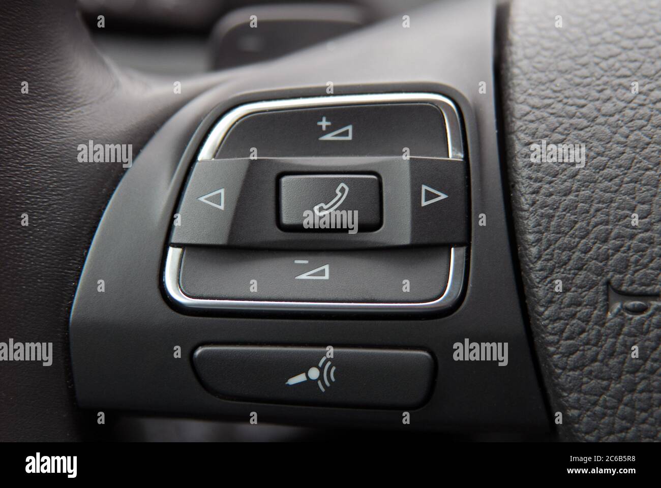 detail on the steering wheel to control cell phones Stock Photo - Alamy
