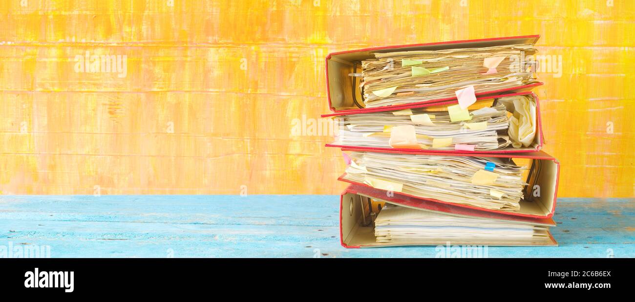 messy file folders and documents, bureaucracy and red tape concept ...