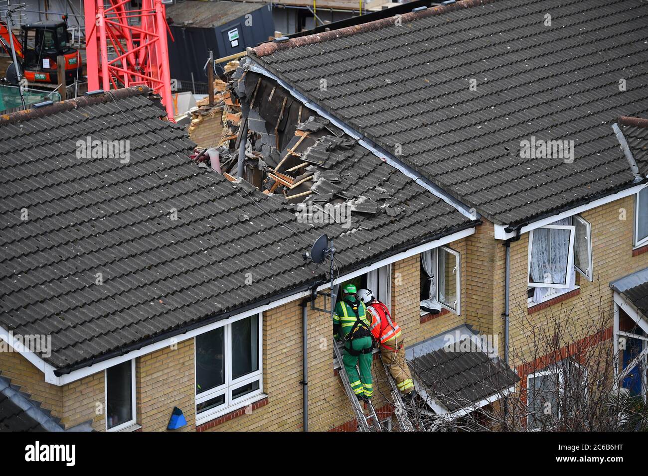 Emergency personnel at the scene in Bow, east London, where a 20-metre ...