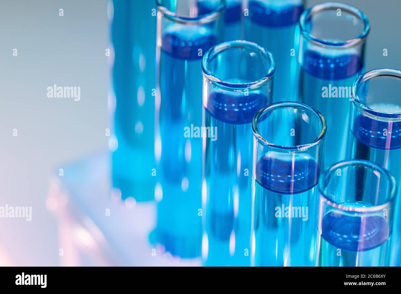 Laboratory test tubes with blue liquid close up Stock Photo - Alamy