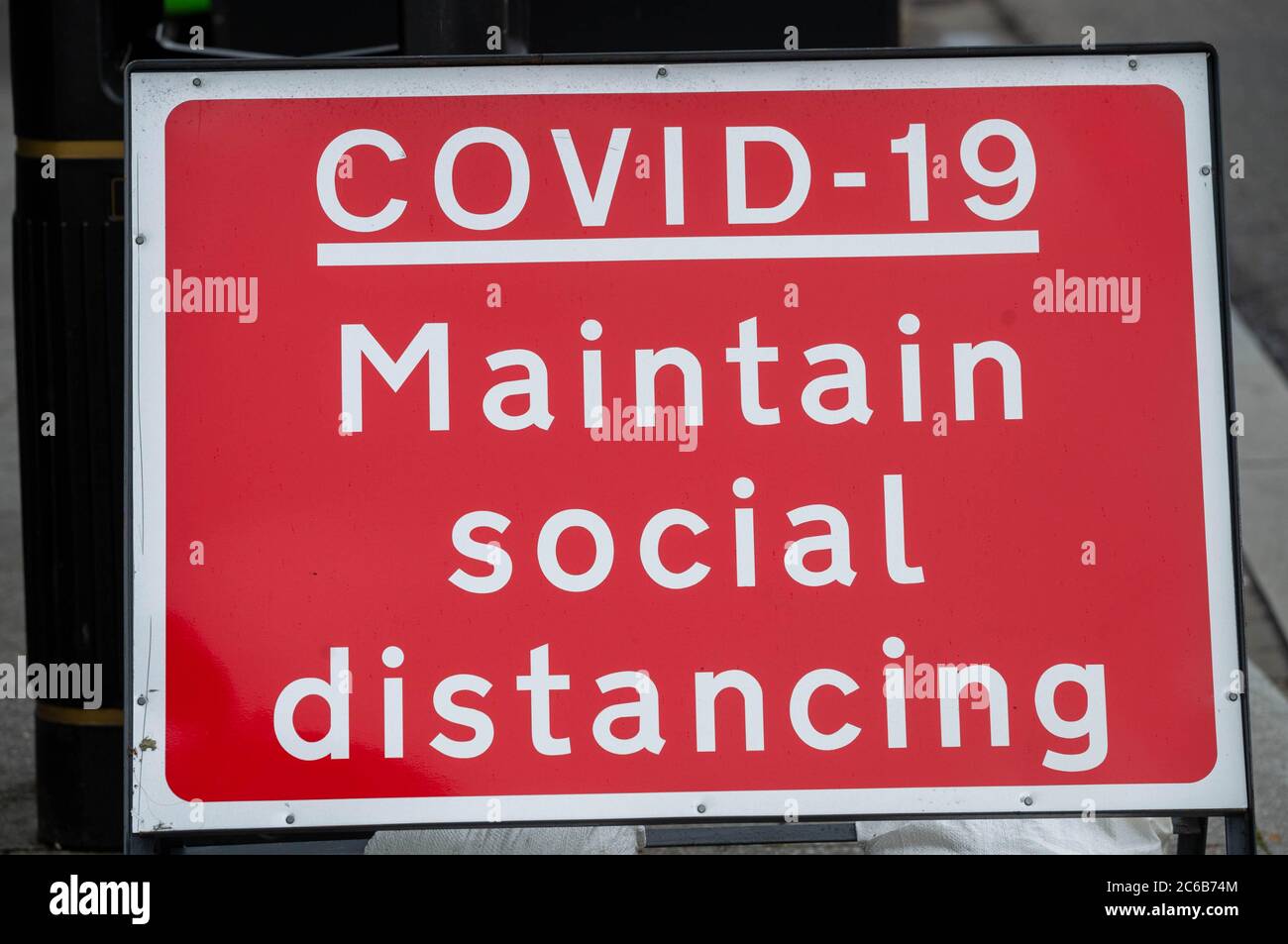 covid-19 maintain social distancing sign Stock Photo - Alamy