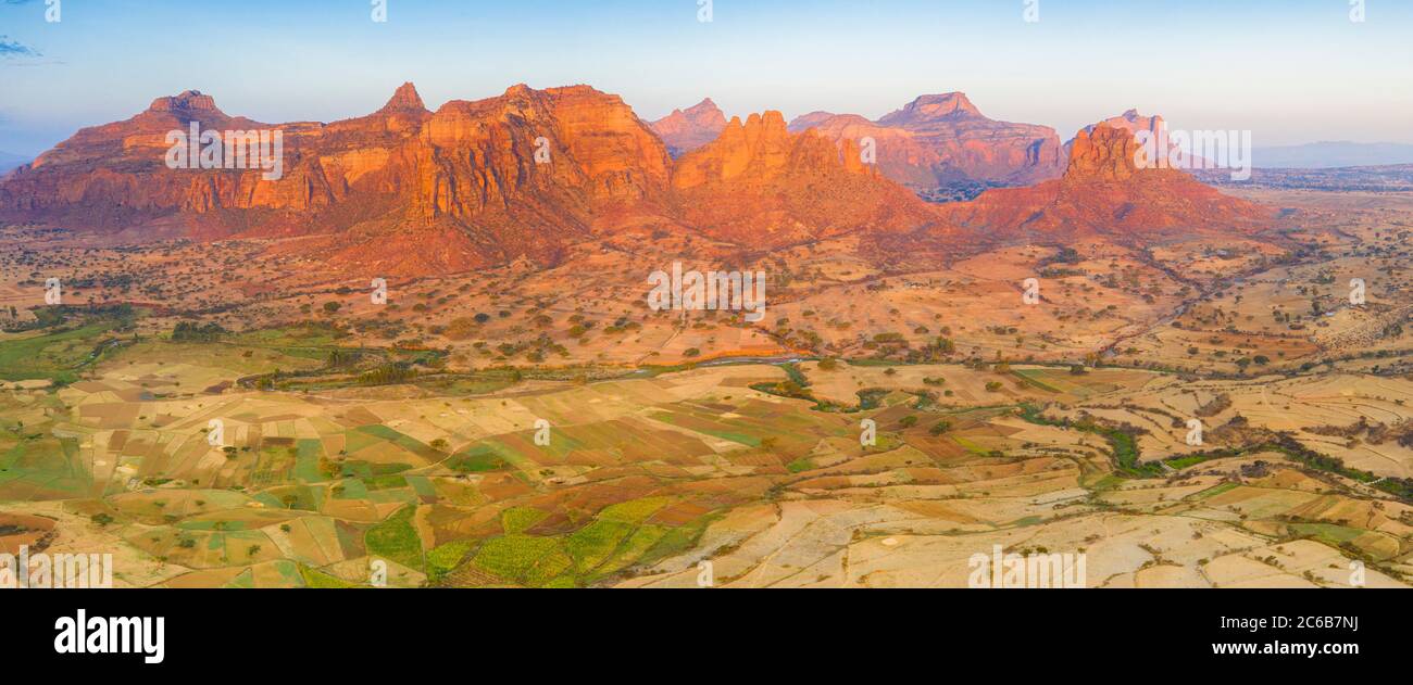 Cultivated fields at feet of the majestic Gheralta Mountains, aerial ...