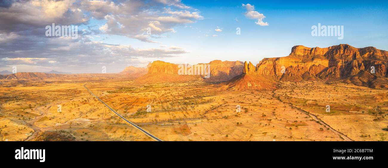 Aerial panoramic by drone of road at foot of Gheralta Mountains canyons ...
