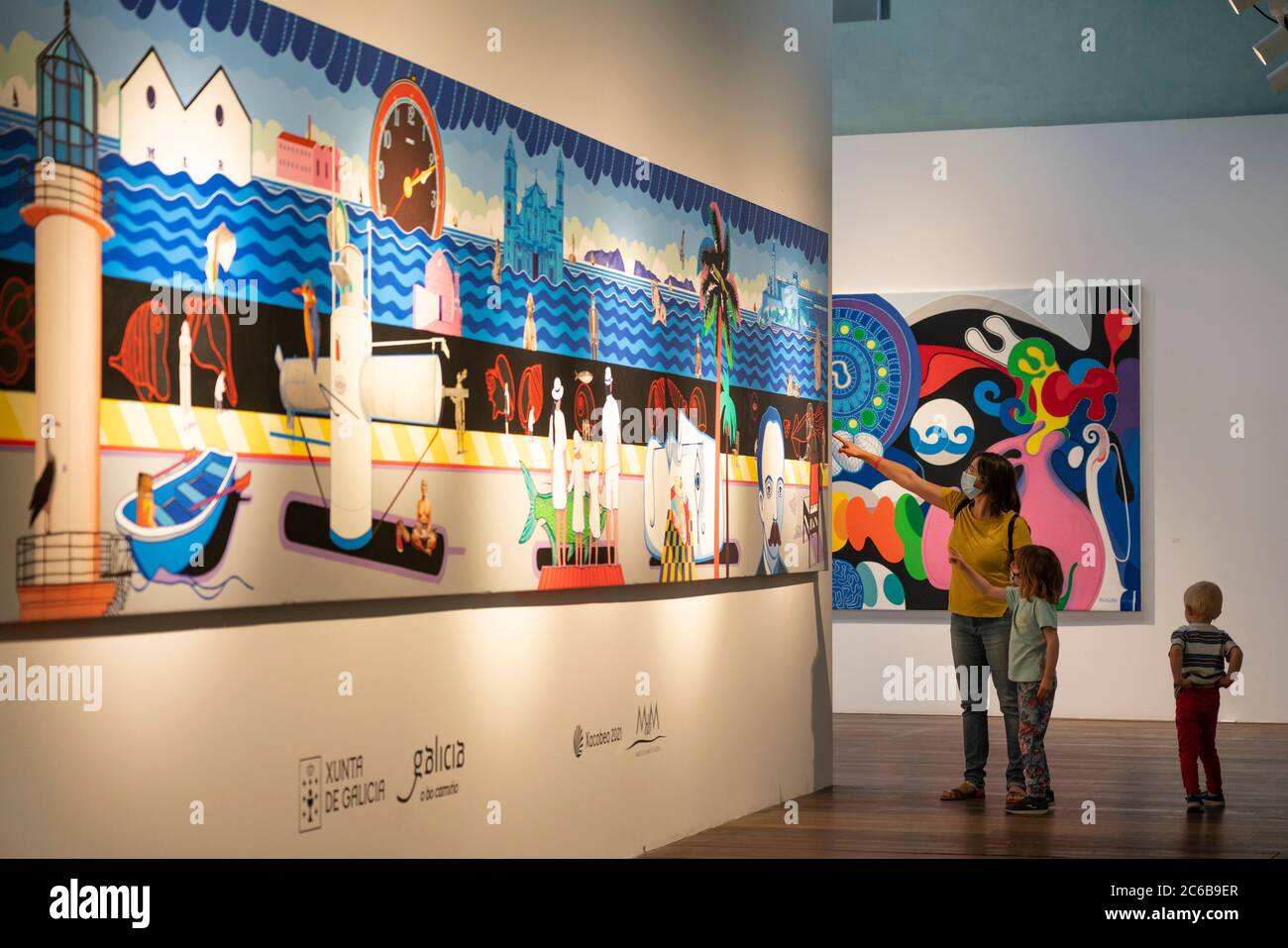 Mother and her two children visiting a contemporary art exhibition by ...