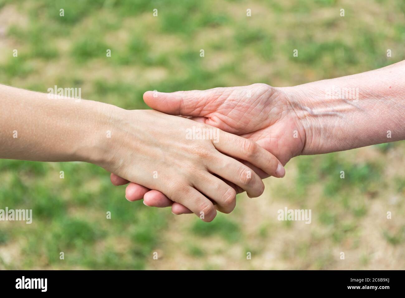 Old young hands touching hi-res stock photography and images - Alamy