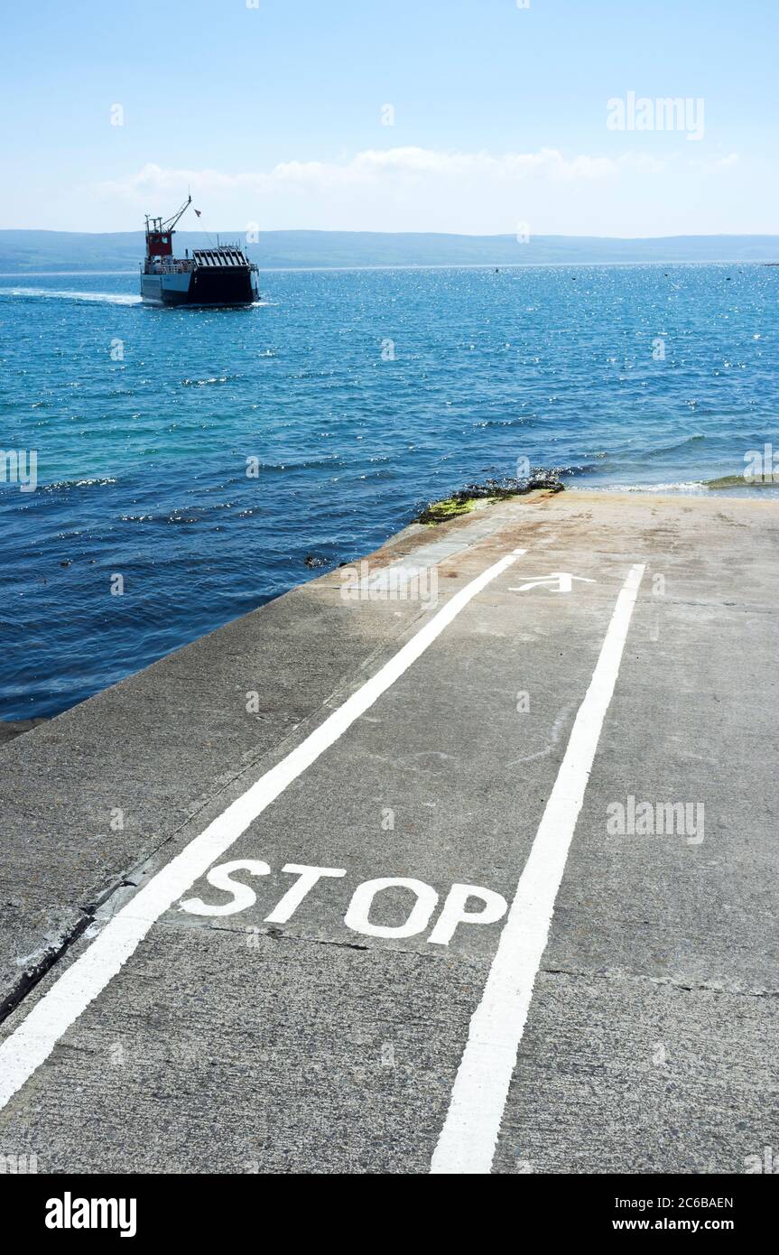 The MV Loch Ranza Ferry arriving at the Island of Gigha from Tayinloan ...