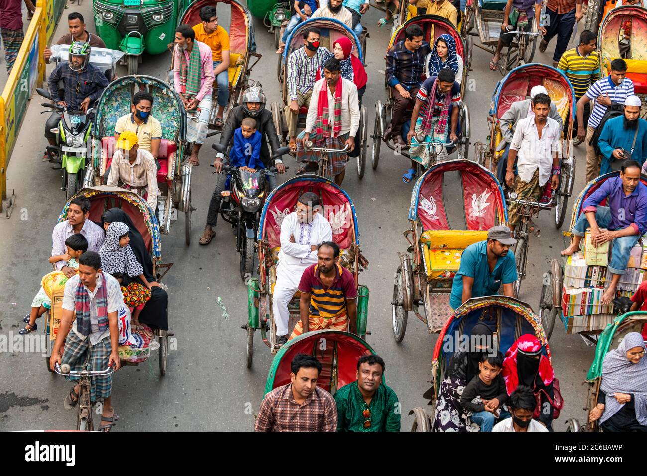 Overcrowded completely with rickshaws, a street in the center of Dhaka ...