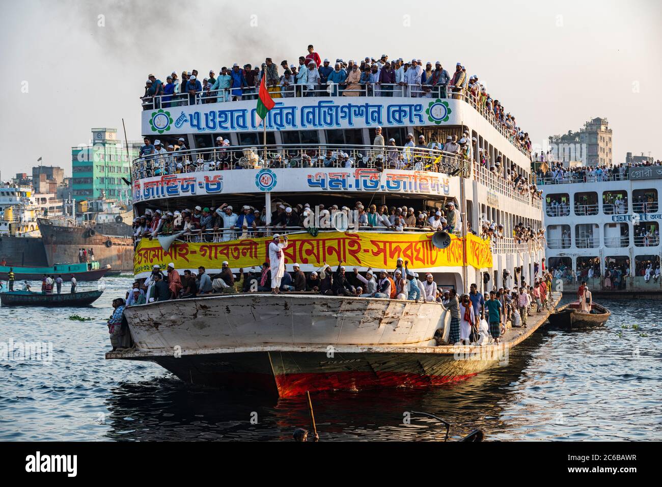 Overloaded passenger ferry with pilgrims on the Dhaka River, Port of ...