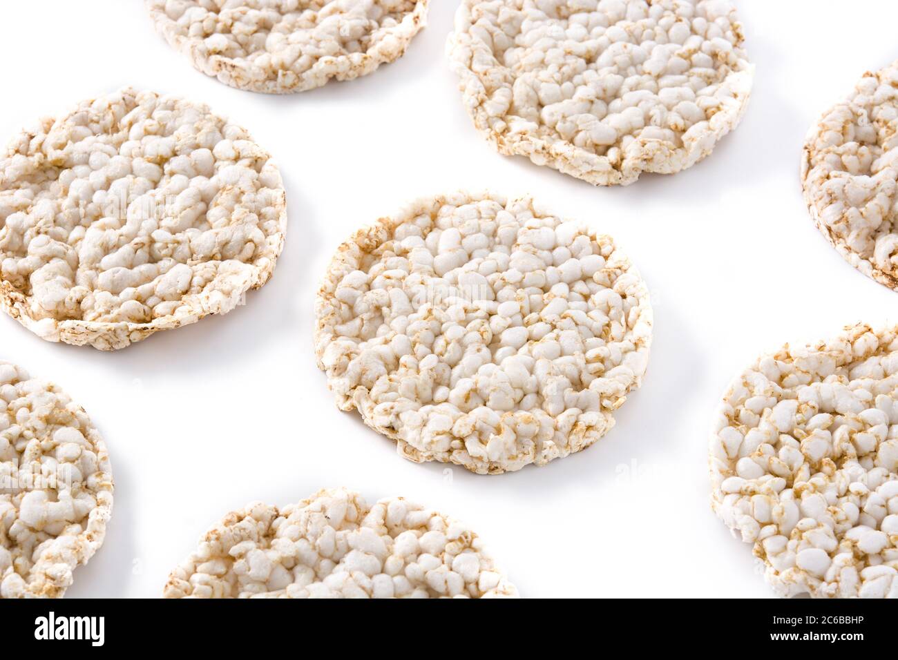 Pile of puffed rice cakes isolated on white background Stock Photo - Alamy