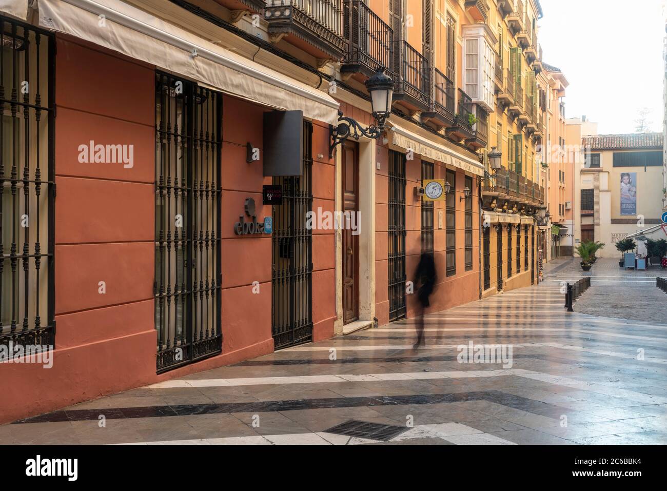 Old street with historic buldings at the center of Malaga, Andalusia ...