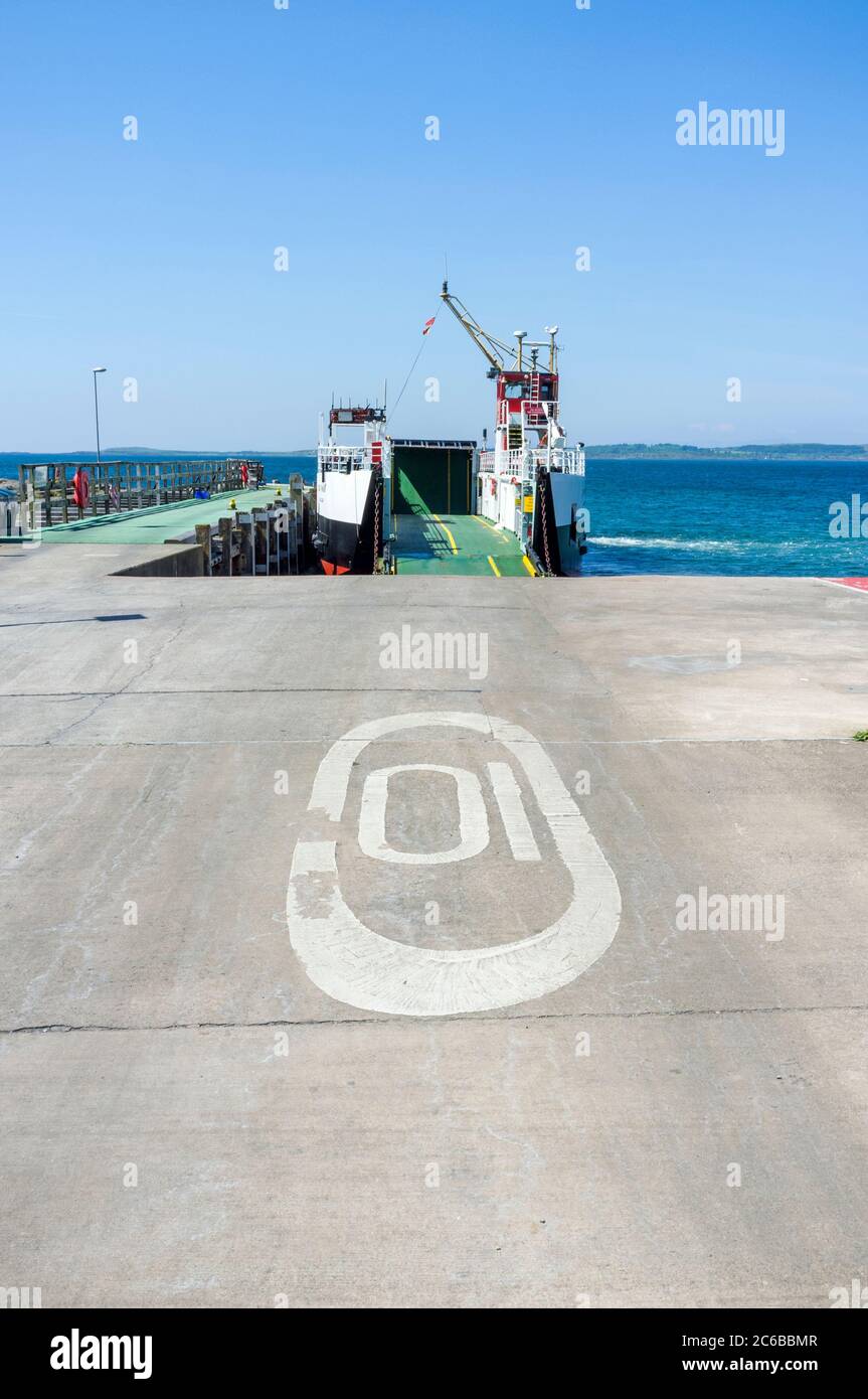The MV Loch Ranza Ferry docked at the Island of Gigha from Tayinloan ...