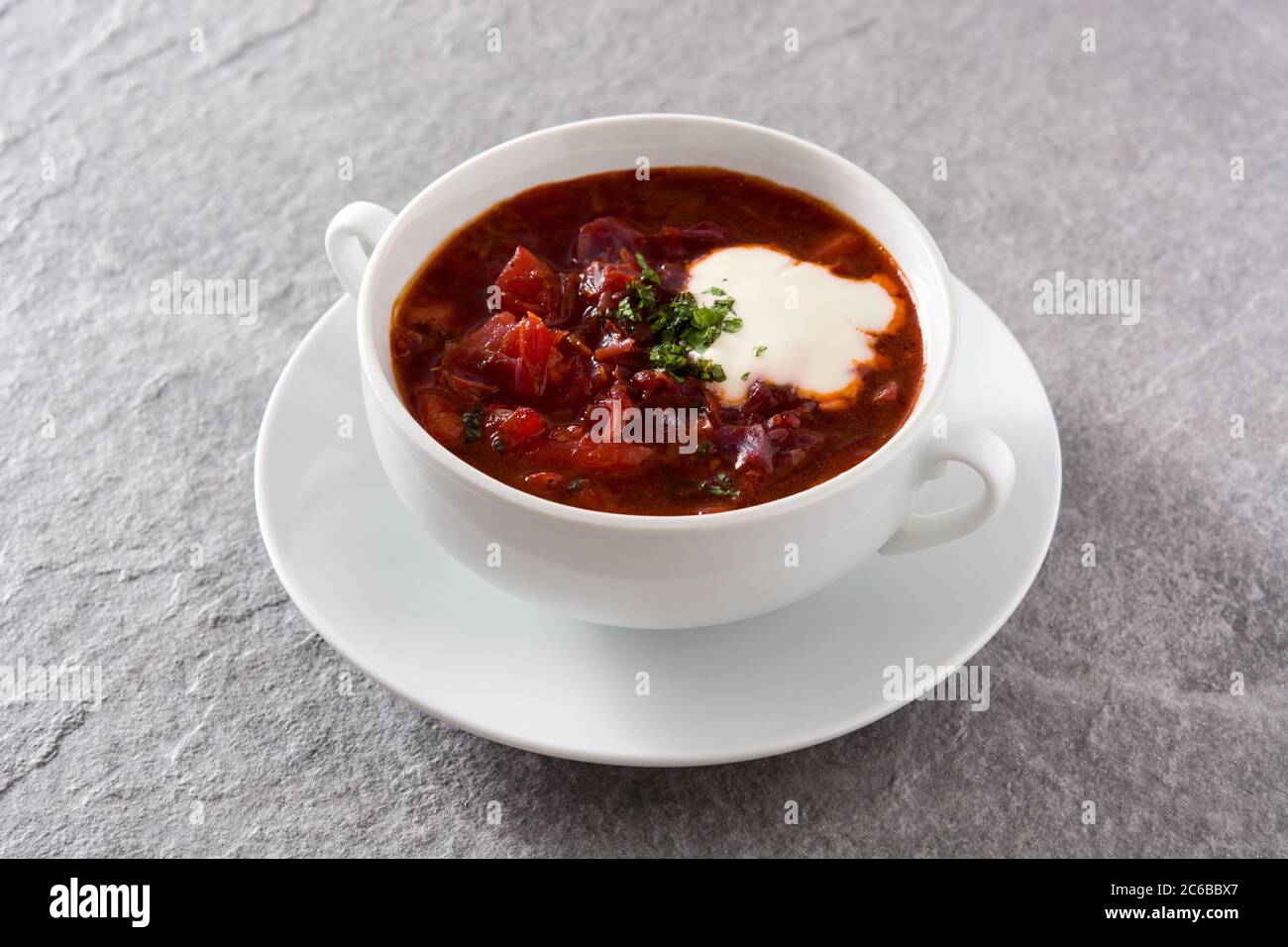 Traditional Ukrainian Russian borsch. Beetroot soup on gray stone ...