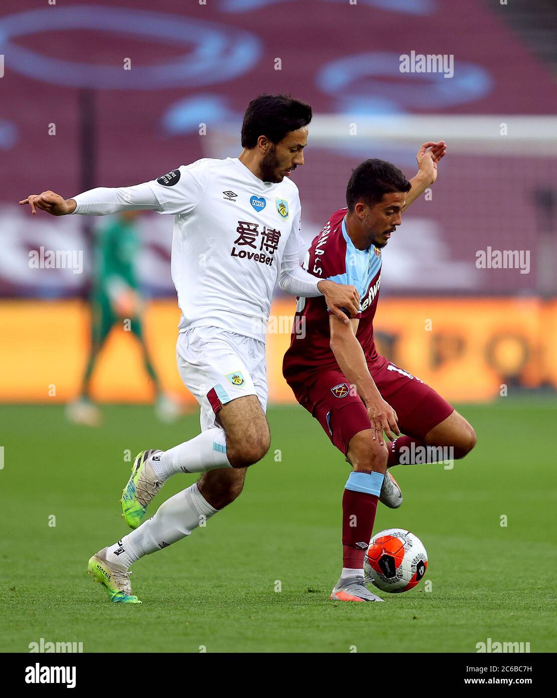 Burnley’s Dwight McNeil (left) and West Ham United's Pablo Fornals ...