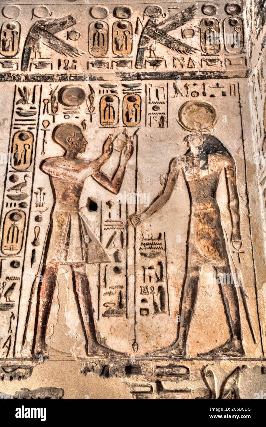 Relief, Pharaoh on left, God Horus on the right, Temple of Khonsu ...