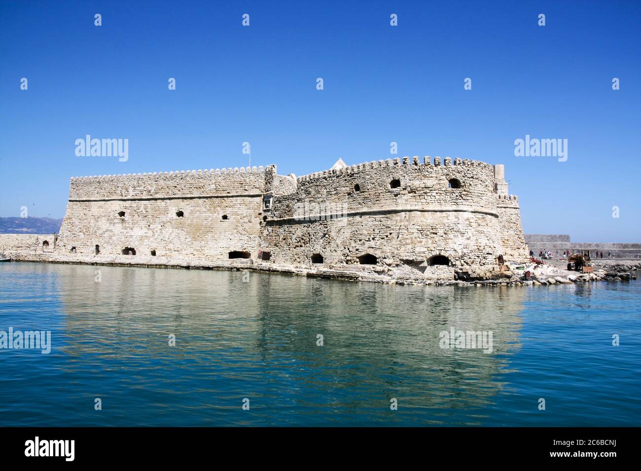 Venetian fort at Heraklion harbor under blue sunny sky in summer time ...