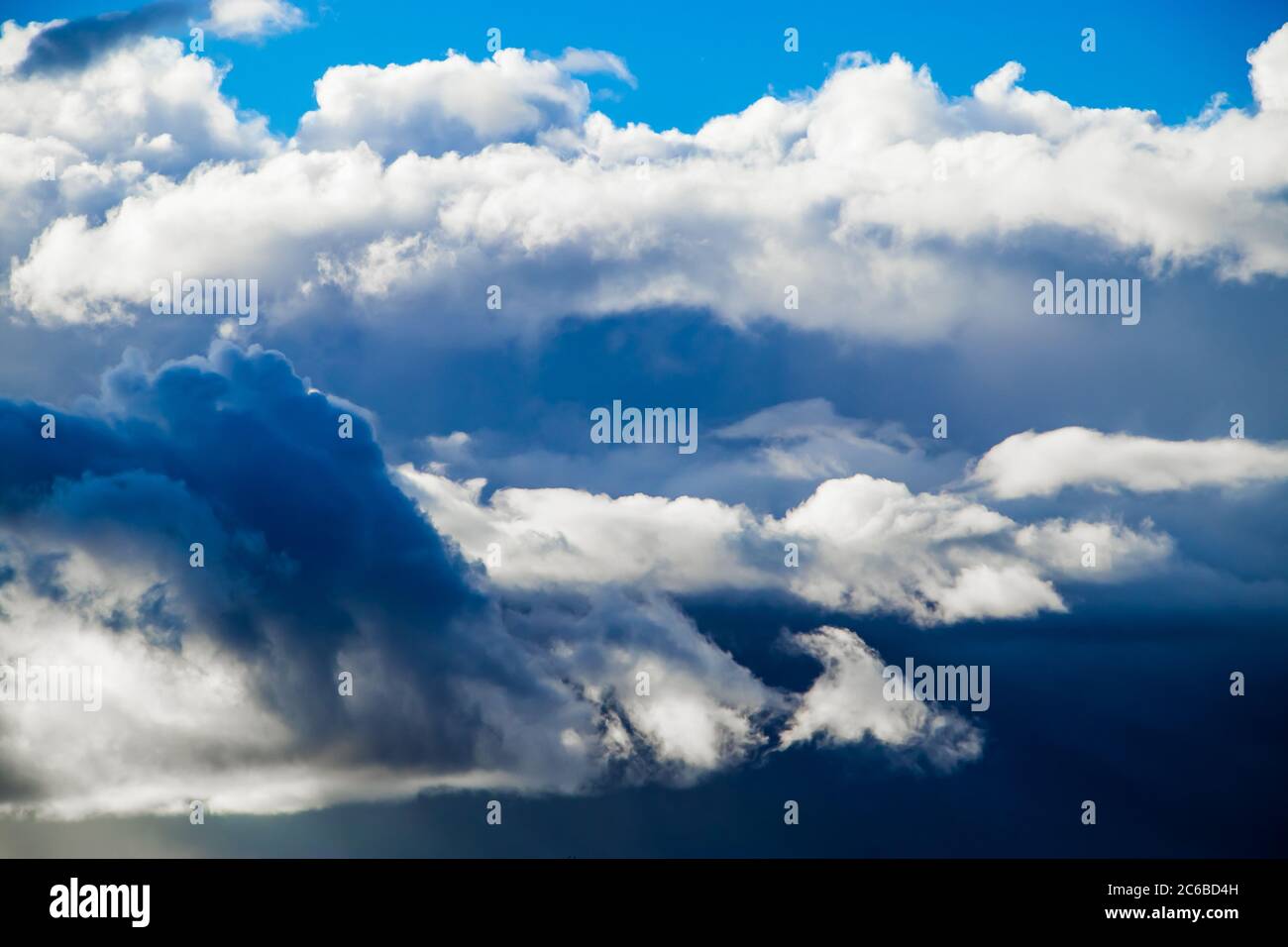 Beautiful storm clouds on a blue sky. Background for design Stock Photo ...