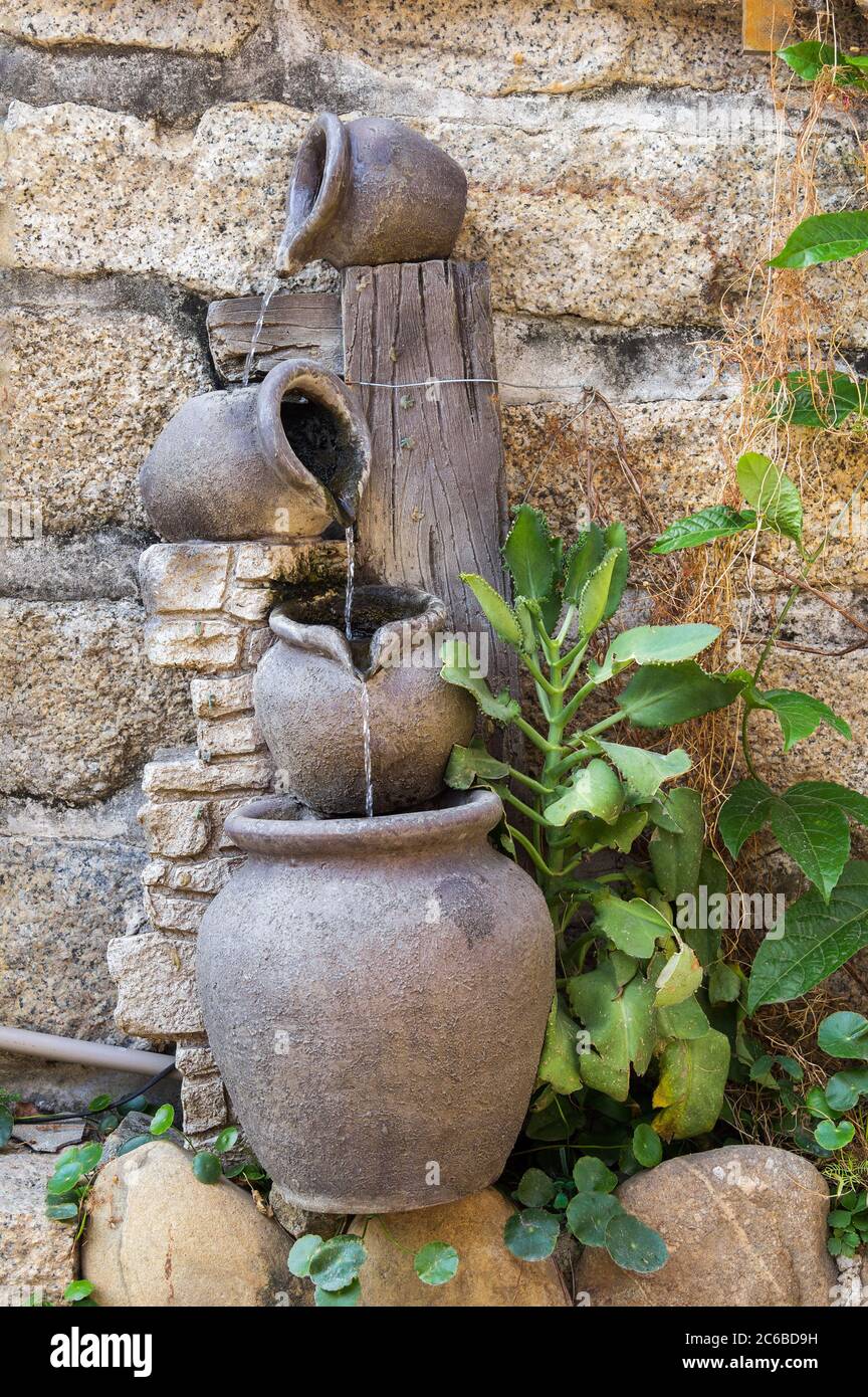 Waterfall decoration with clay jars Stock Photo - Alamy