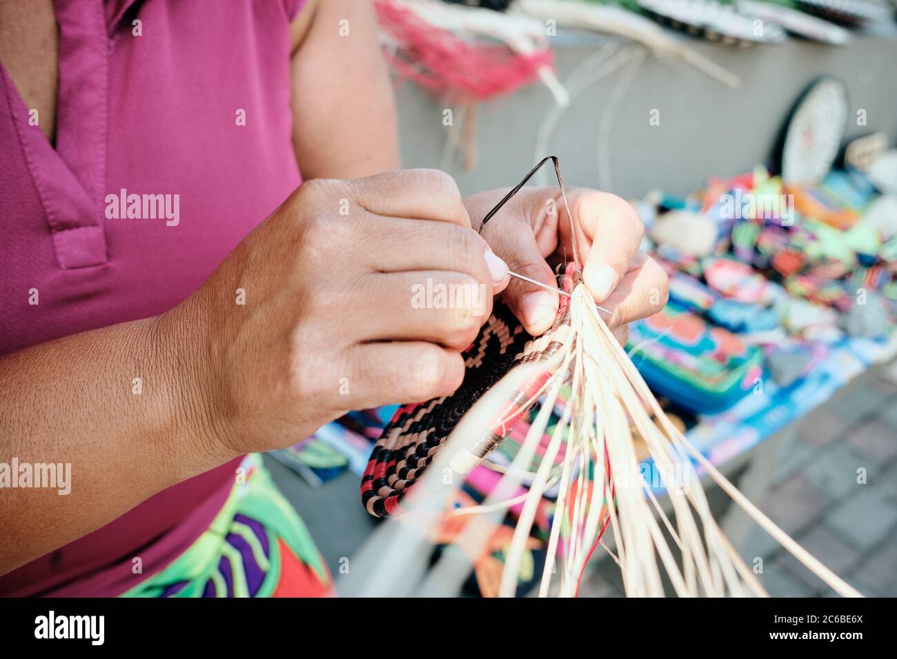 Indigenous Woman Weaving Coaster At Street Market Stall Stock Photo - Alamy
