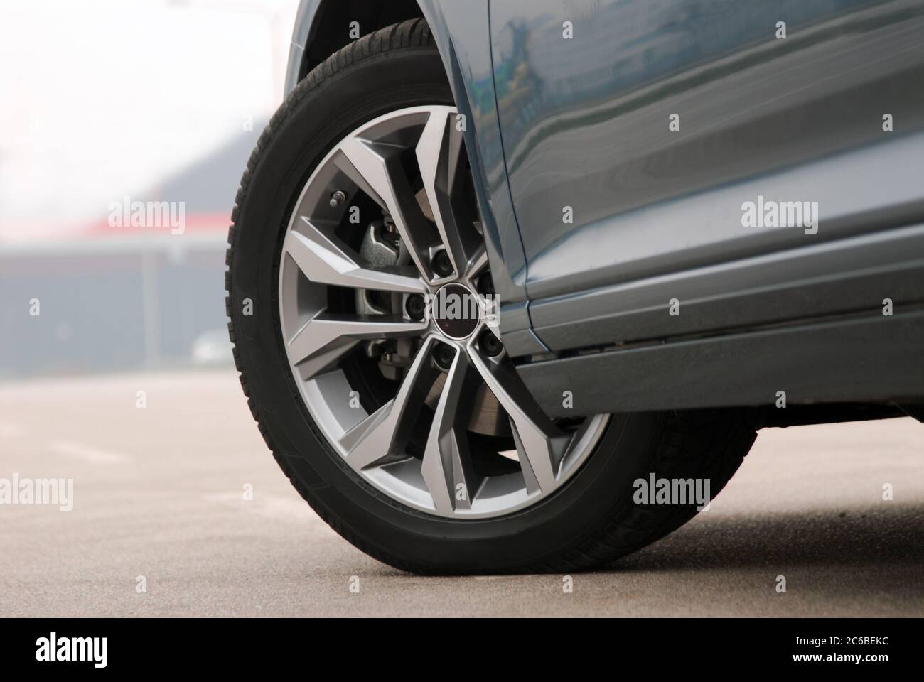 car wheel, tire and alloy wheel on this passenger car Stock Photo - Alamy