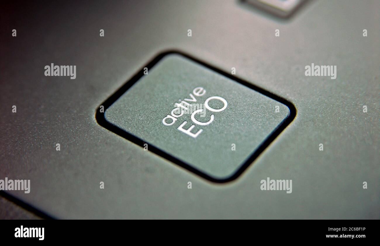 Eco button on the control panel of car Stock Photo - Alamy