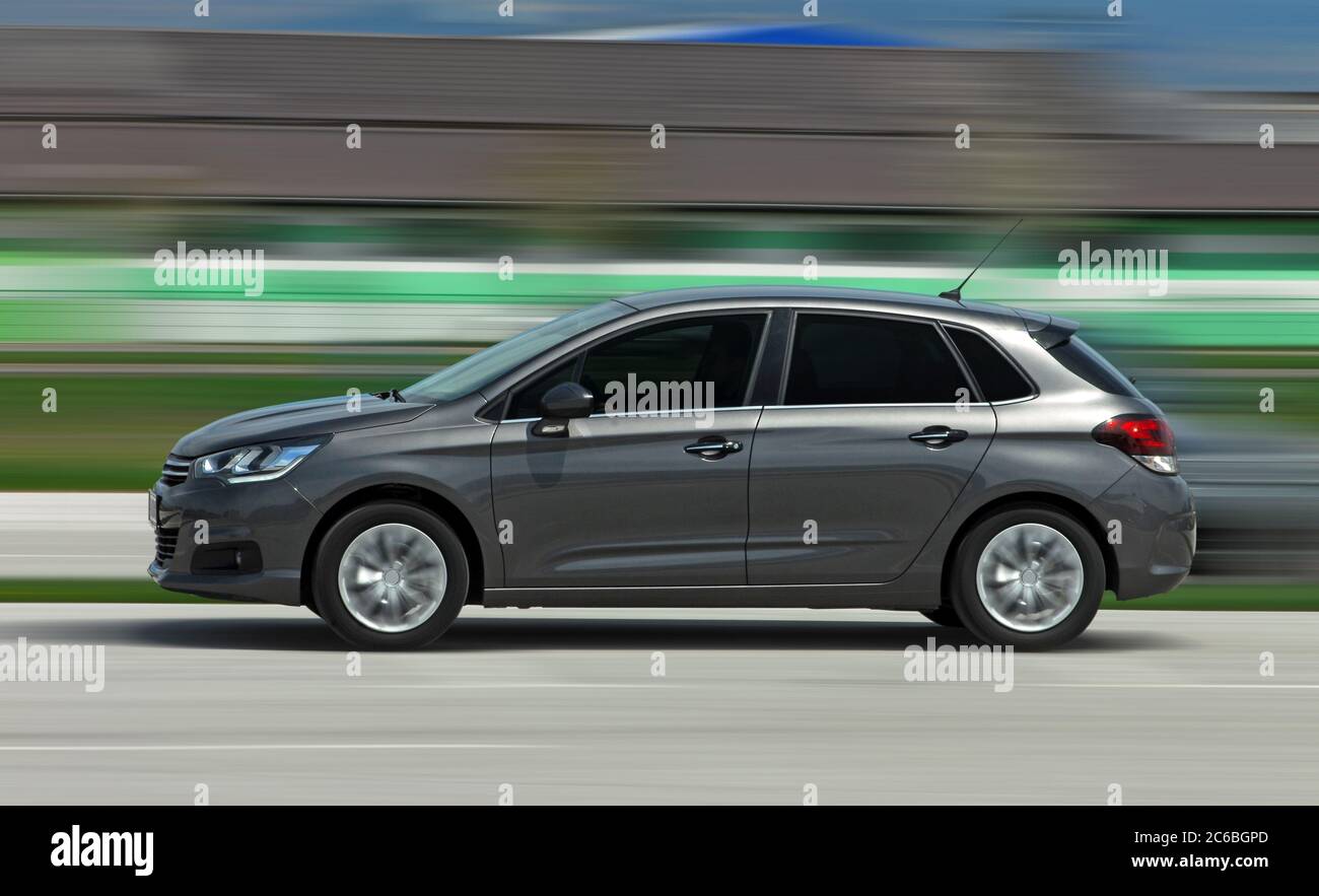 moving car, A panning shot of a speeding passenger car Stock Photo - Alamy