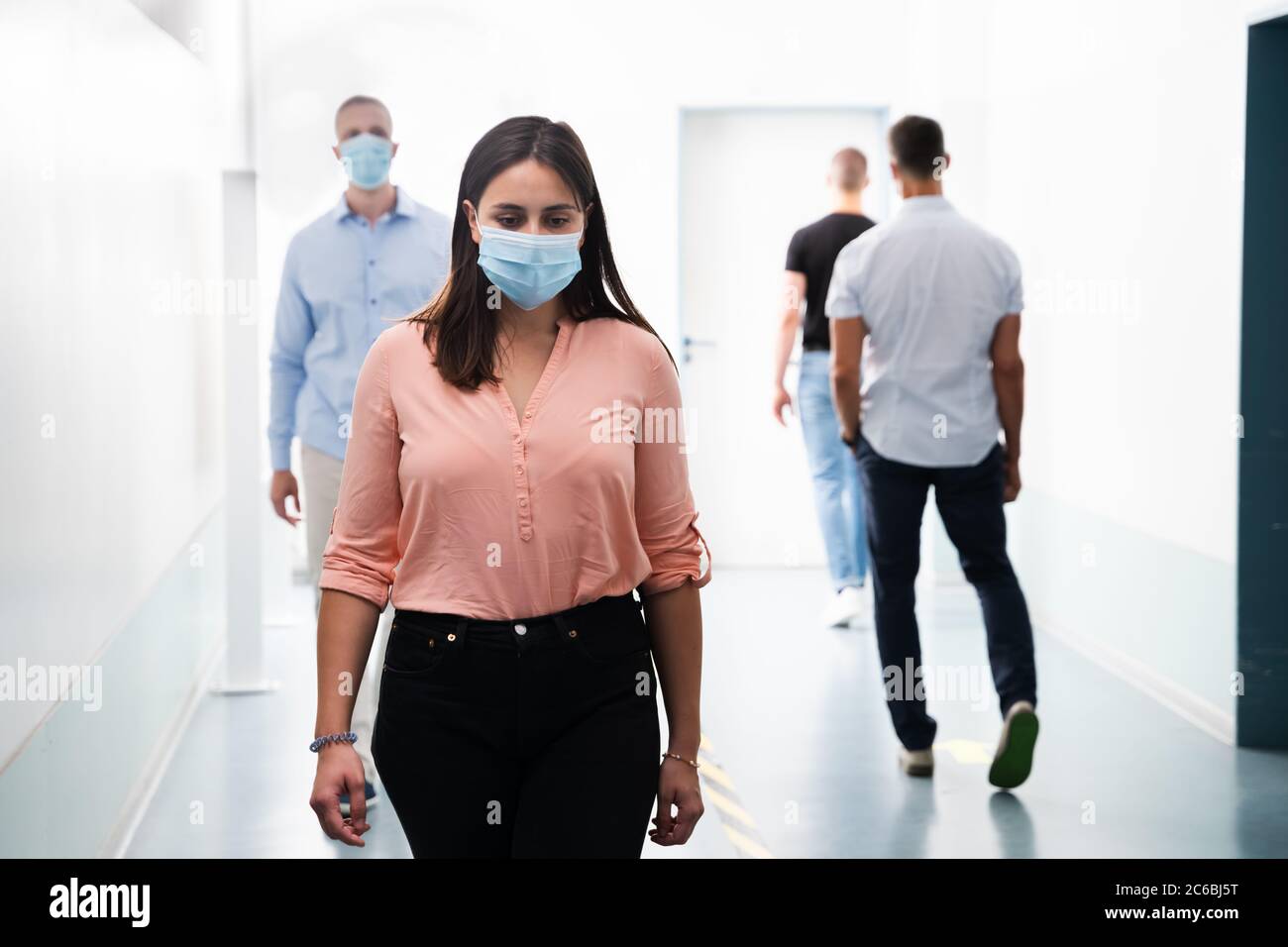 People In Office Following Social Distancing Protocols Wearing Face ...