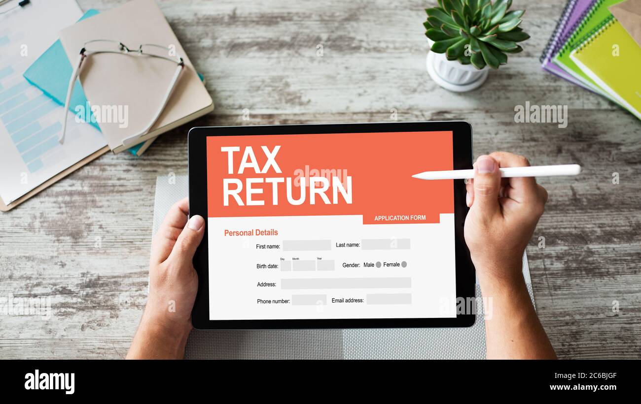 Online tax return application on screen. Business and finance concept ...