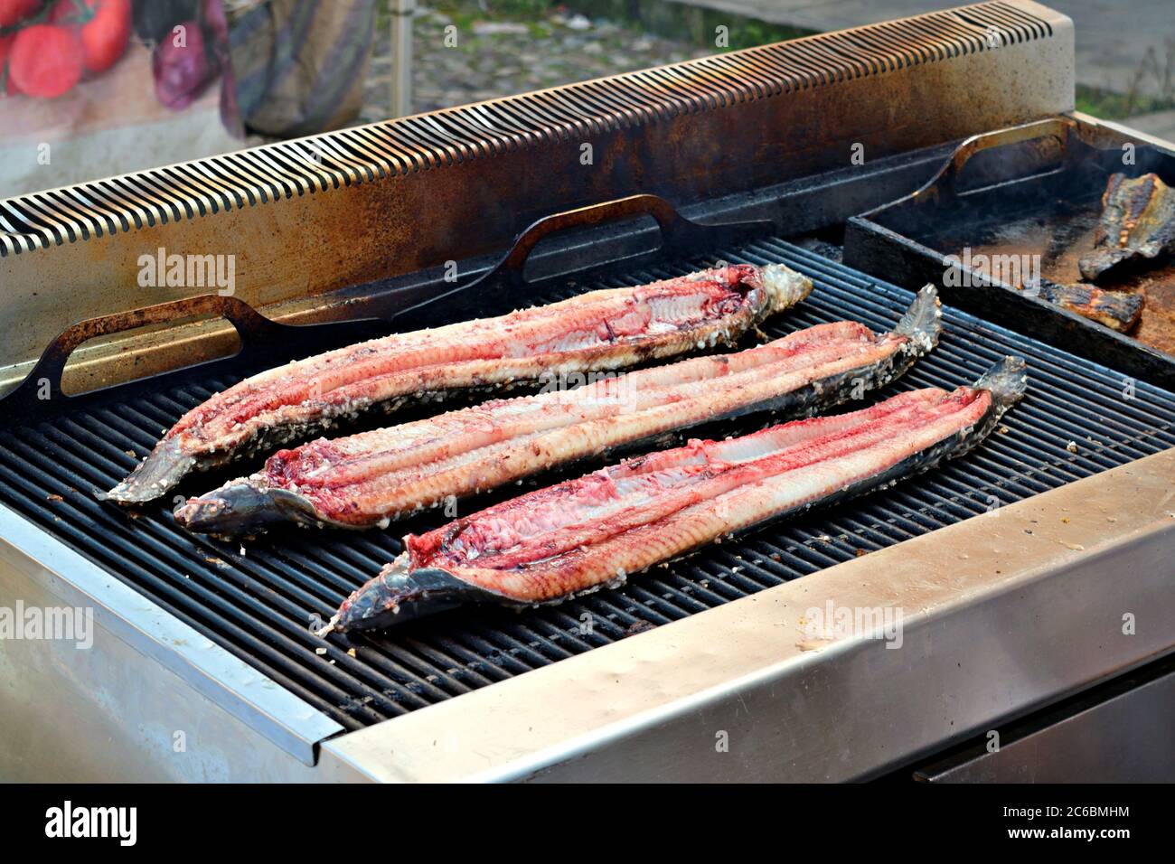 grilled eels during the traditional eel festival in the village of ...