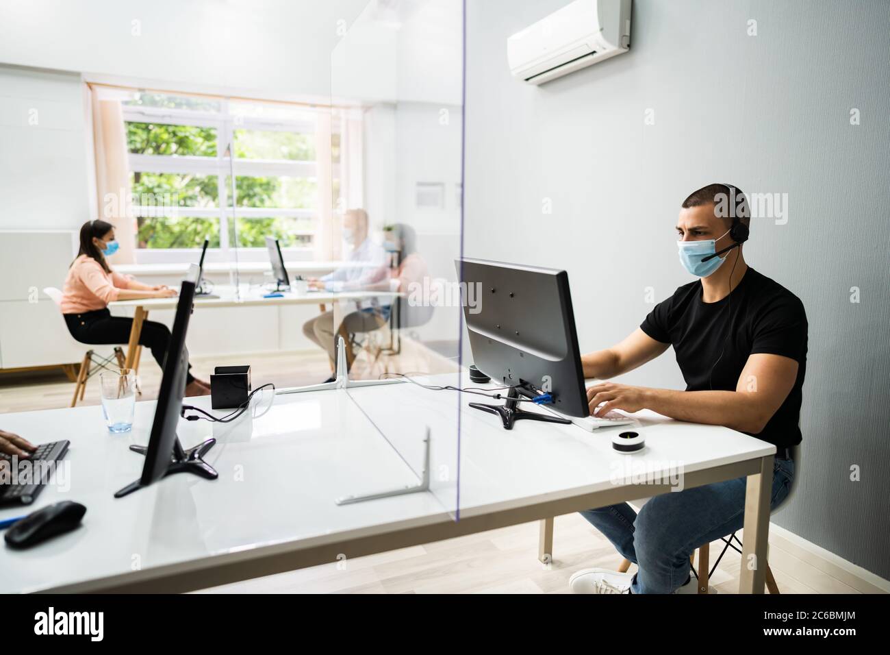 Call Center Customer Service Agents Wearing Face Masks Stock Photo - Alamy