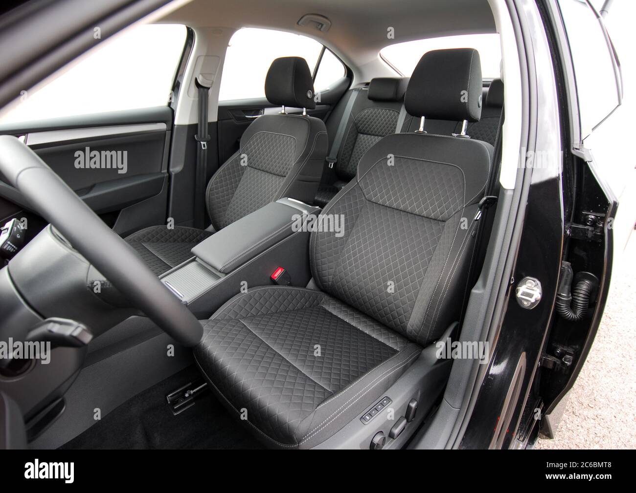 Front car seats, Front seats of a modern passenger car Stock Photo - Alamy