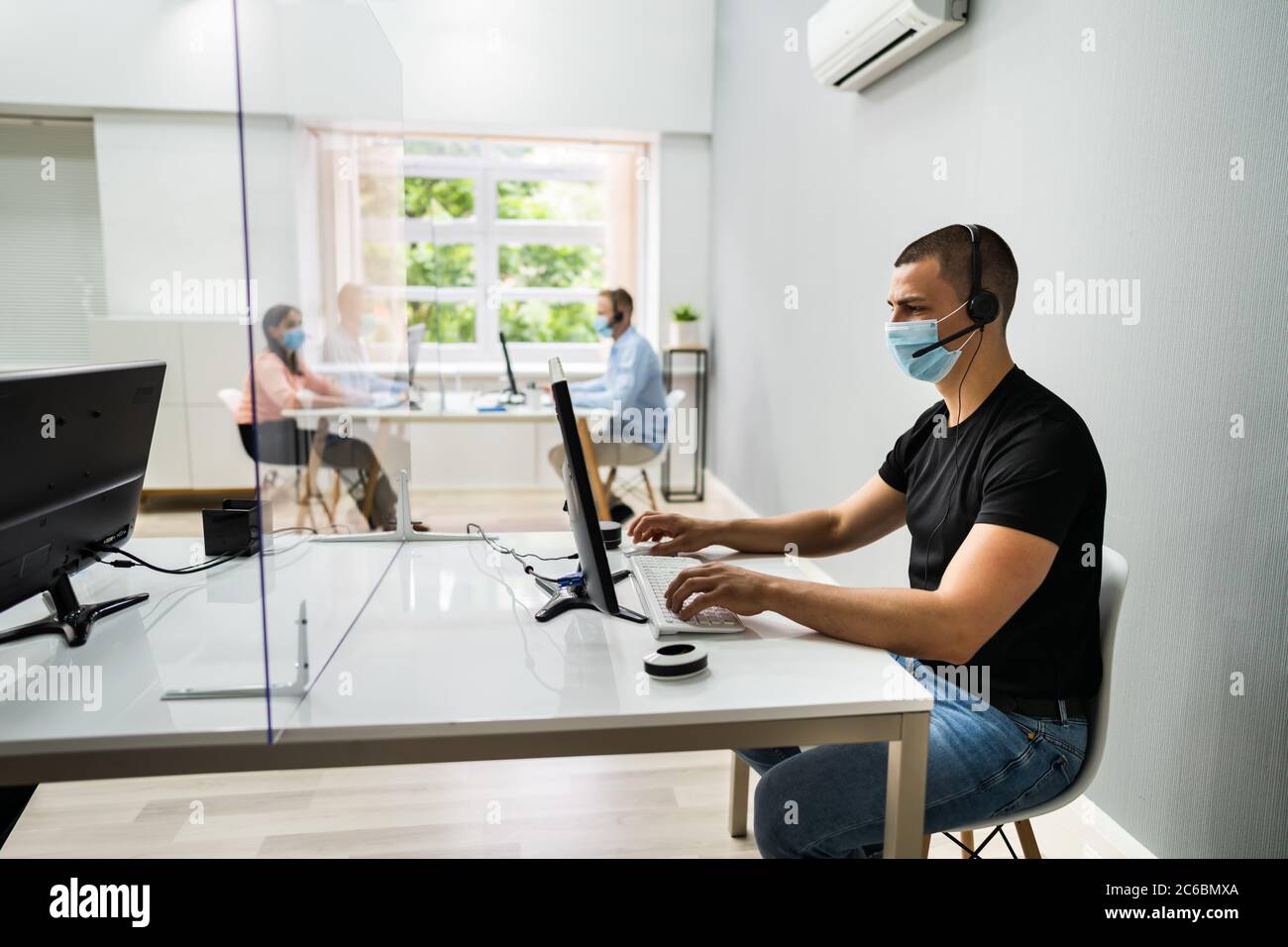 Call Center Customer Service Agents Wearing Face Masks Stock Photo - Alamy