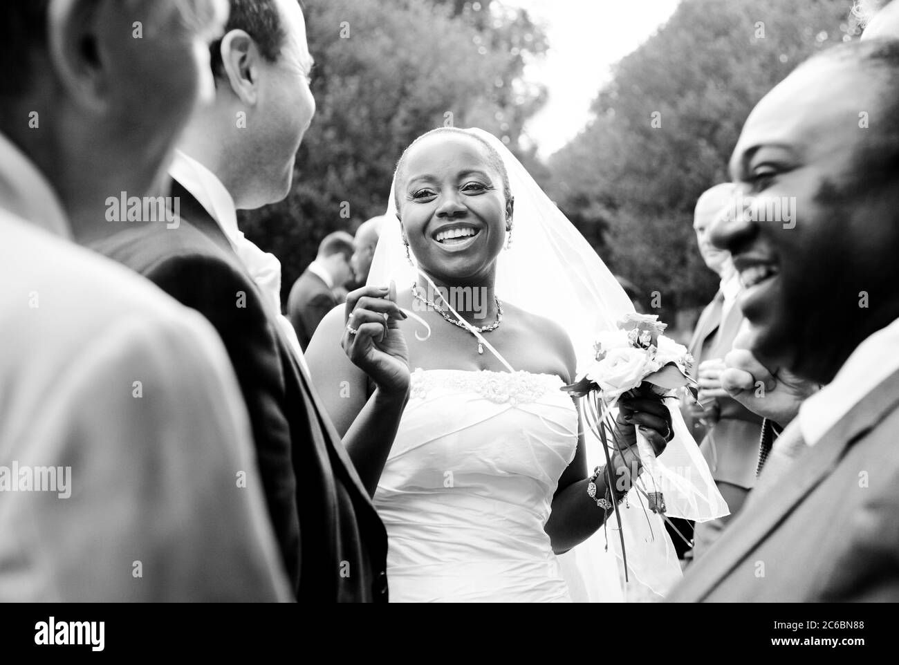 Beautiful, stunning black bride twenties or thirties smiling and joyful ...