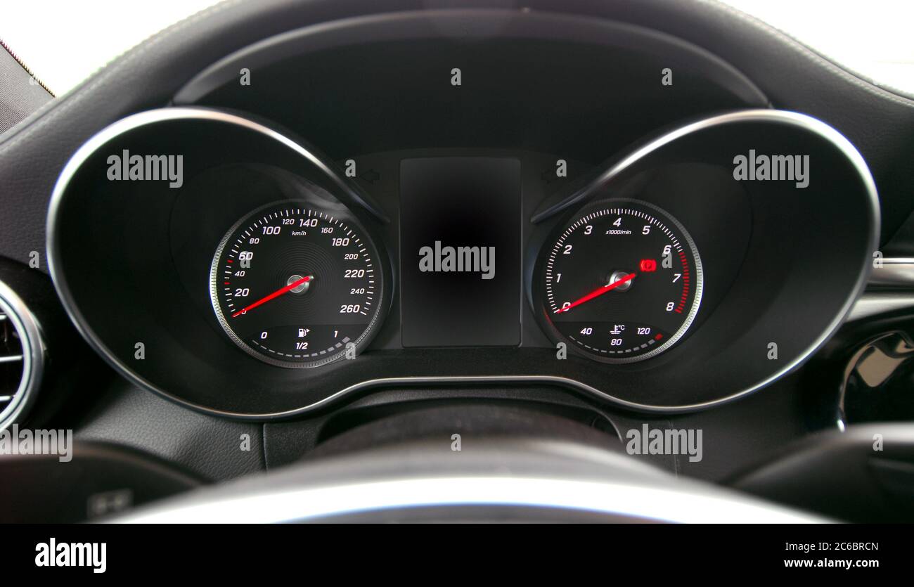 Car illuminated dashboard. Modern car illuminated dashboard closeup ...