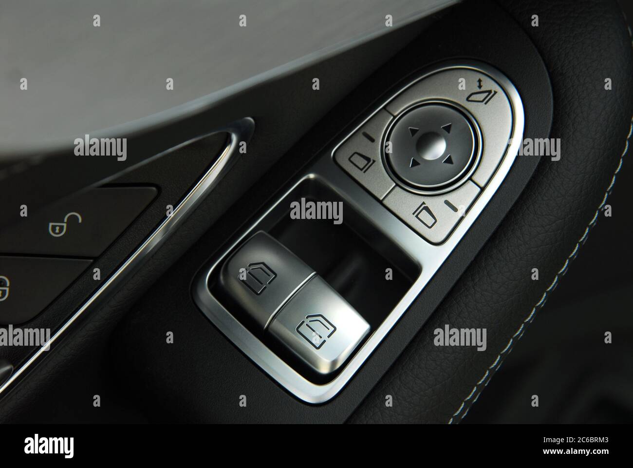 Side mirror switch control and window button Stock Photo - Alamy