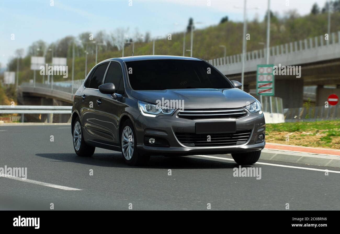 driving too fast, car going at high speed cornering Stock Photo - Alamy