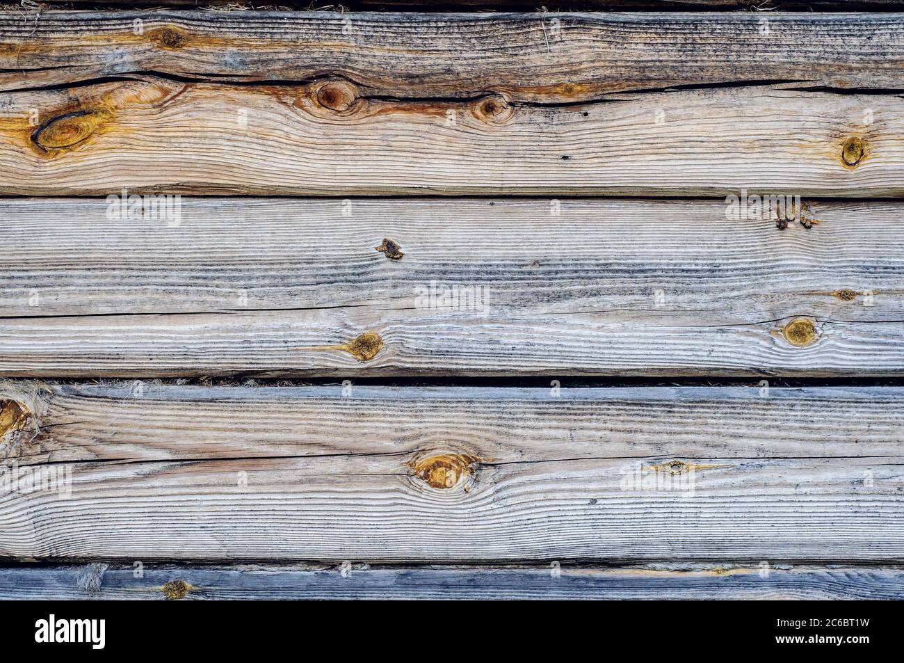 Wooden background. Logs on the wall of the log frame as a background ...