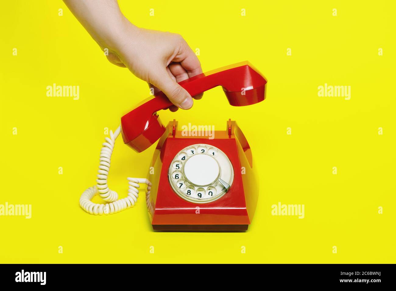 Hand red telephone receiver hi-res stock photography and images - Alamy
