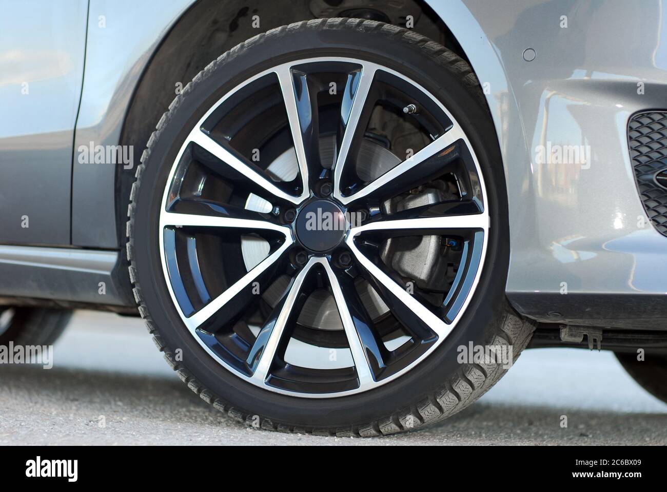 Car wheel. Tire and alloy wheel on this passenger car Stock Photo - Alamy