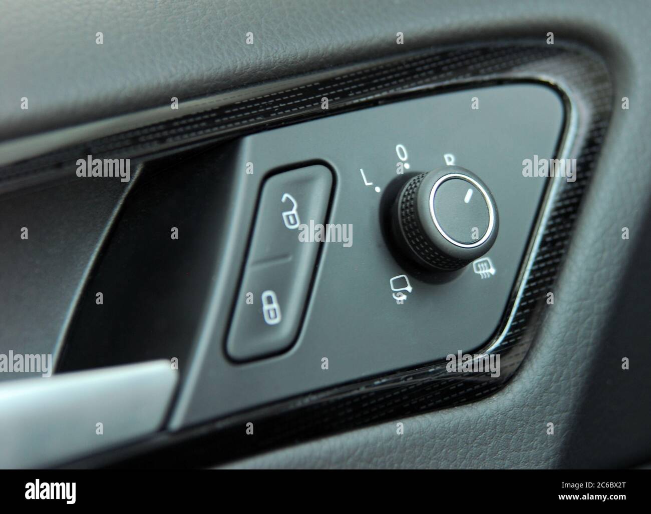 Side mirror switch control and central locking button Stock Photo - Alamy