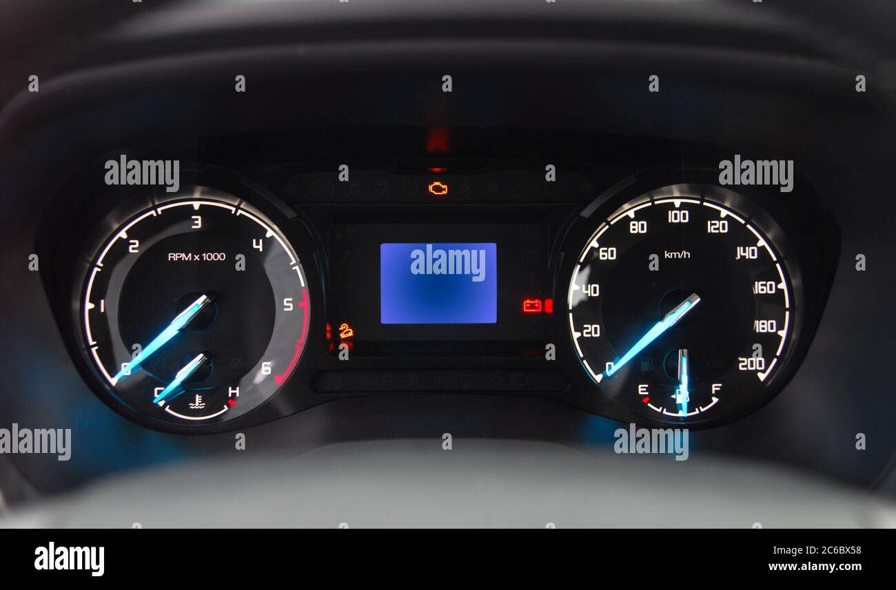 Car illuminated dashboard. Modern car illuminated dashboard closeup ...