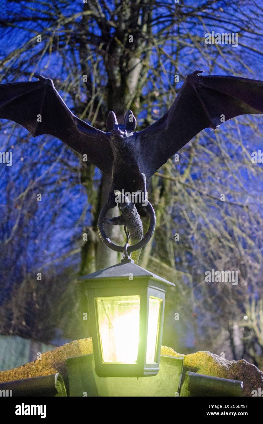 Brest, Belarus - March 29, 2020: The statue of a bat with a flashlight ...