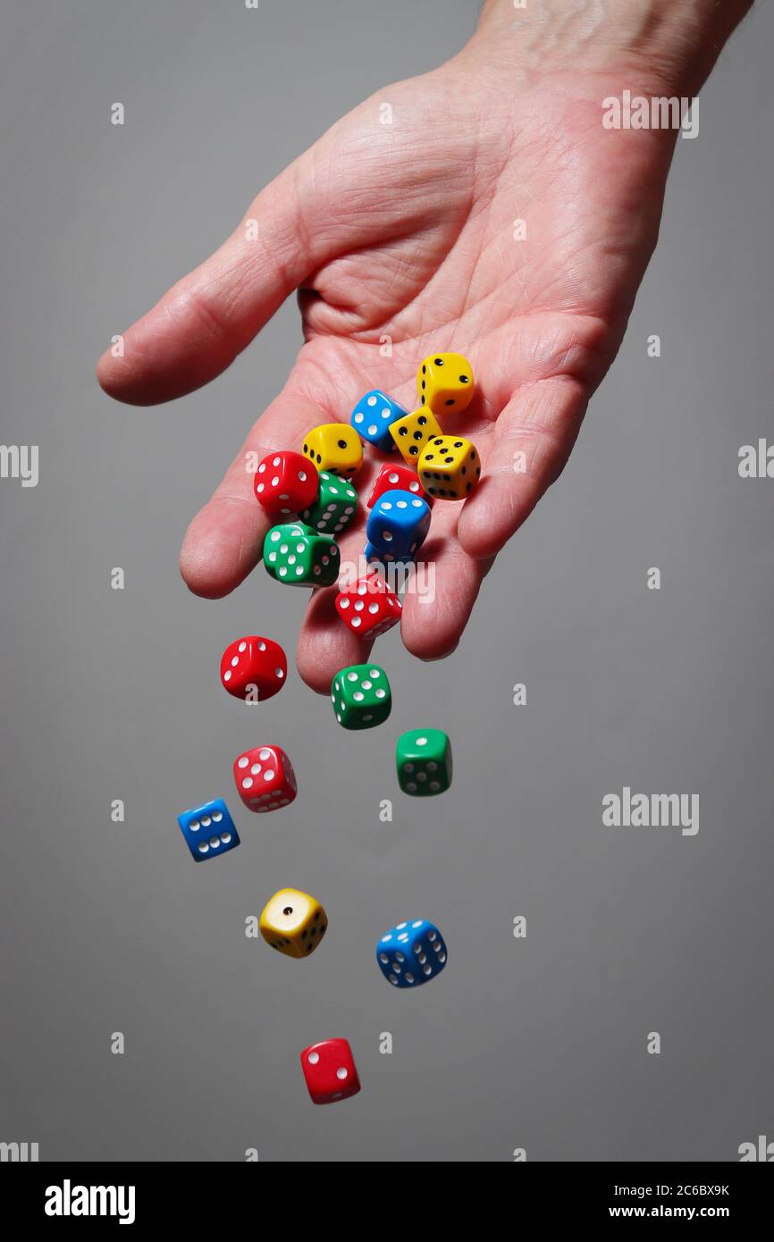 Hand throwing dice hi-res stock photography and images - Alamy
