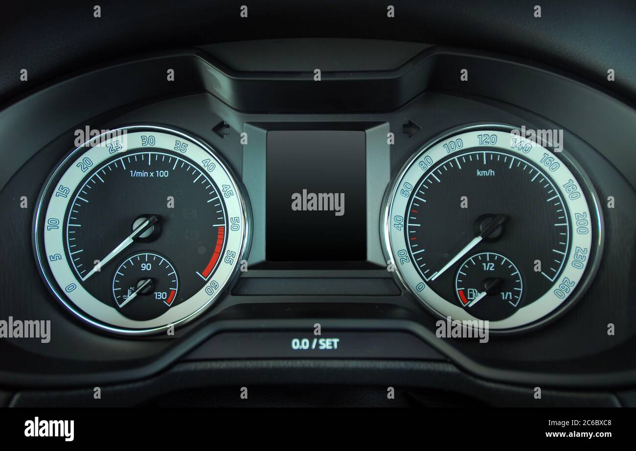 Car illuminated dashboard. Modern car illuminated dashboard closeup ...