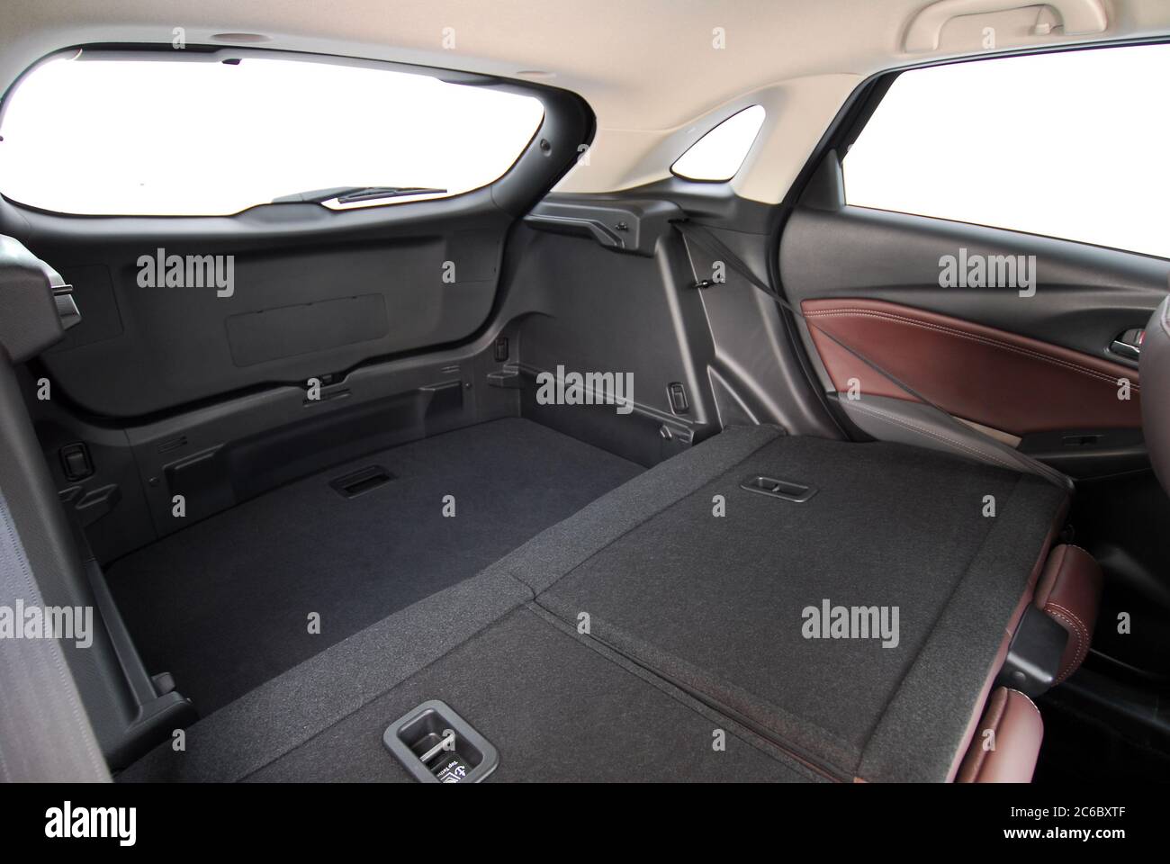 Car trunk. Car trunk with rear seats folded inside view Stock Photo - Alamy