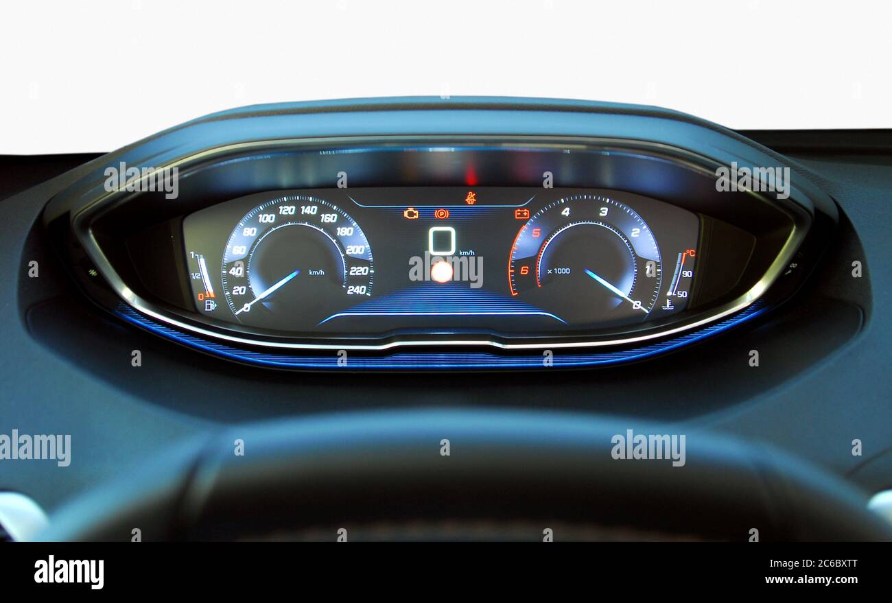 Car illuminated dashboard. Modern car illuminated dashboard closeup ...