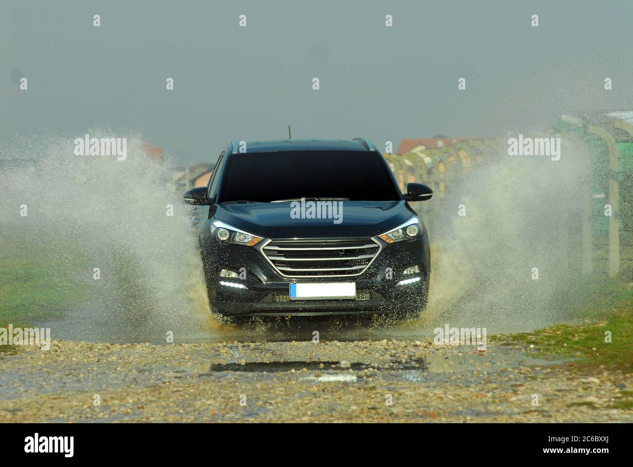 Car driving through flooded road natural disaster hi-res stock ...