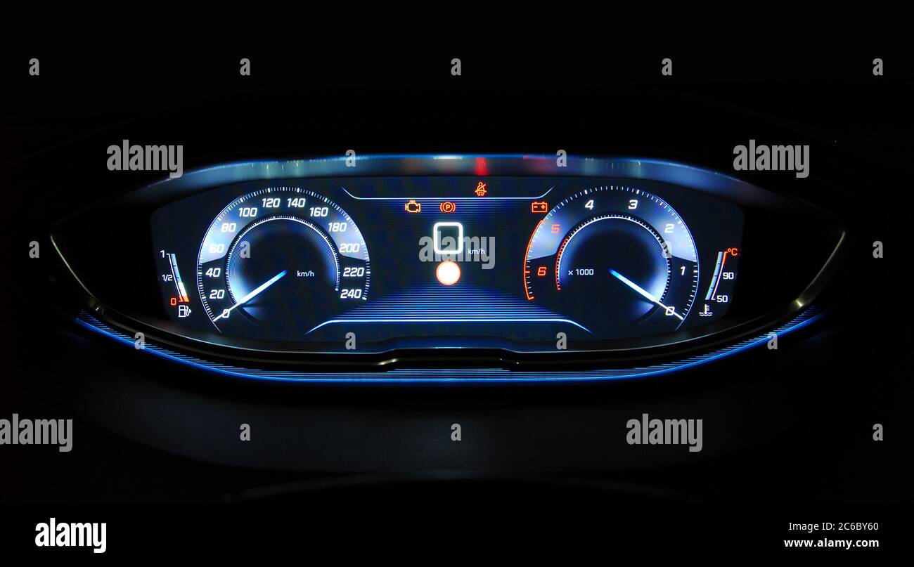 Car illuminated dashboard. Modern car illuminated dashboard closeup ...