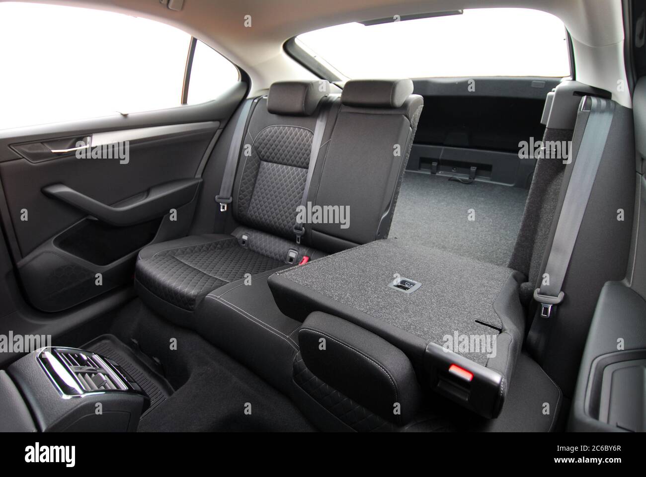 Folded rear seat of the car. Down rear seats in a modern passenger car ...
