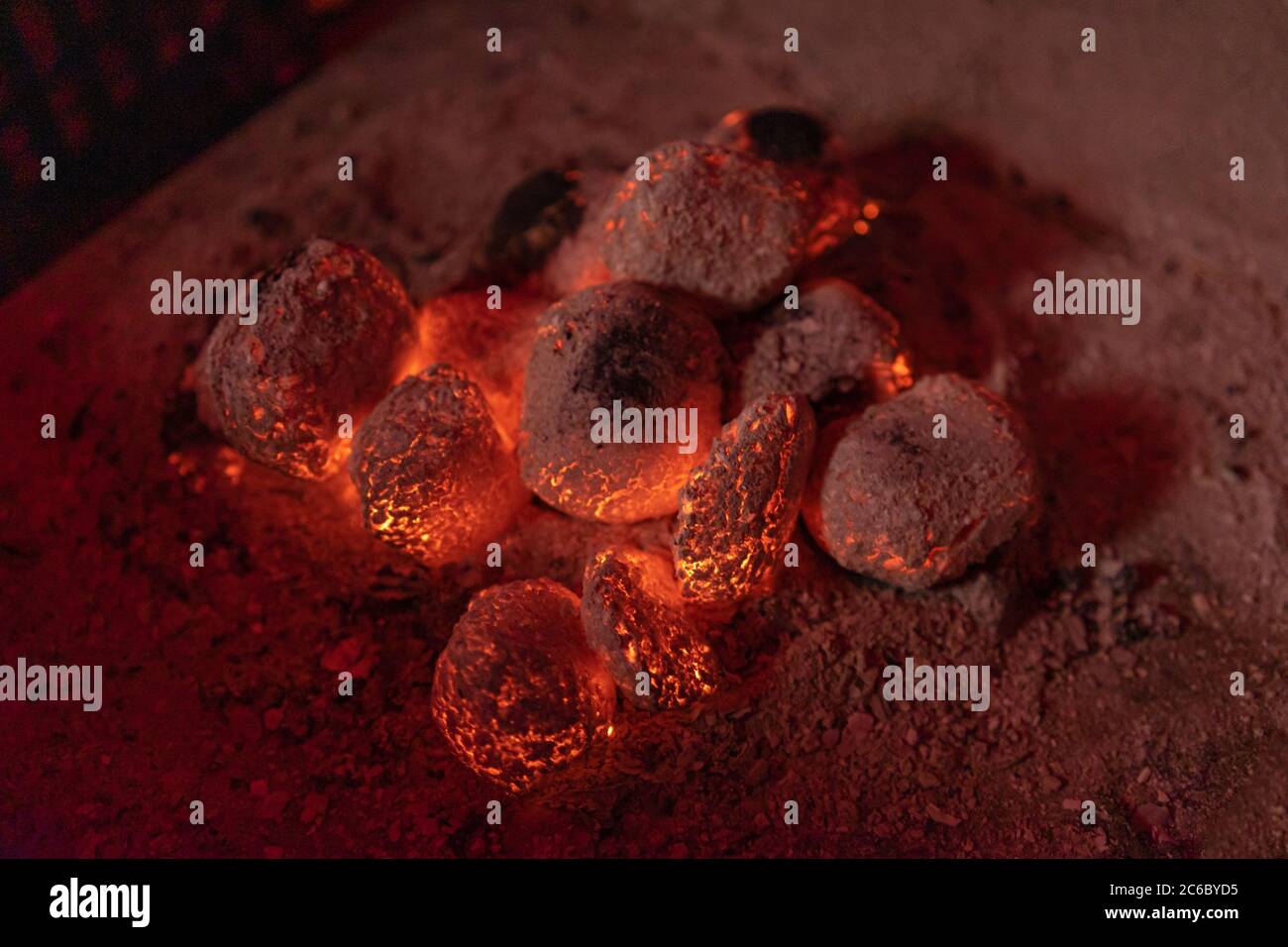 Red hot coals burning in bbq fire place close up Stock Photo - Alamy